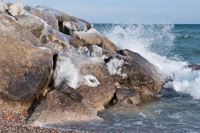 Ice Covered Rocks on a Beach in Winter Stock Photo - Image of rocks ...