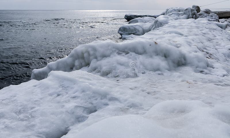 Ice-covered Shore, Rocks and Coastal Cliffs. the Black Sea is Frozen ...