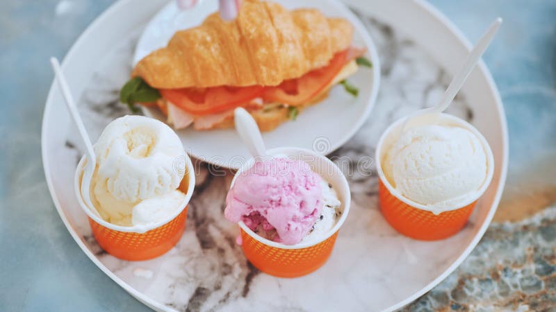 Ice Cream and Croissant with Meat on the Plate at the Cafe. Stock Photo ...