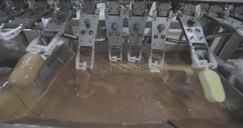 Ice Cream is Dipped in Chocolate. Ice Cream Factory Stock Footage ...