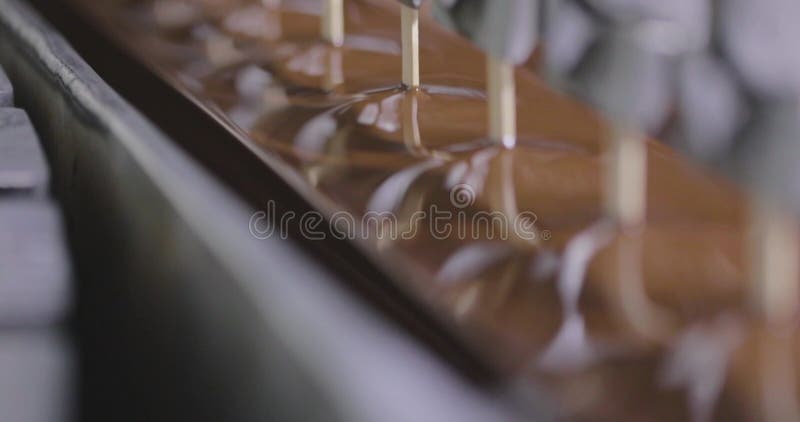 Ice Cream is Dipped into Melted Chocolate Close-up. Chocolate Dripping ...