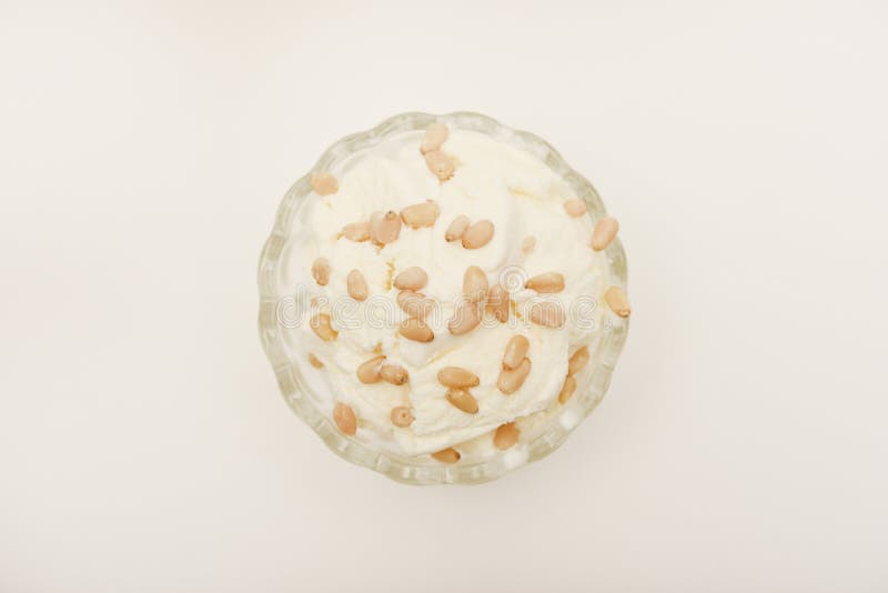 Ice Cream in a Glass Ice Cream Maker with Pine Nuts. Ice Cream with ...