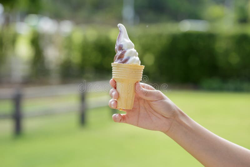 Ice cream in hand. stock photo. Image of mellow, hand - 82132532