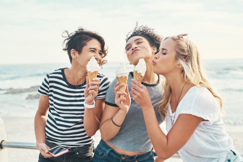 Ice Cream Puts Everyone In A Better Mood Three Friends Eating Ice While Out On The Promenade