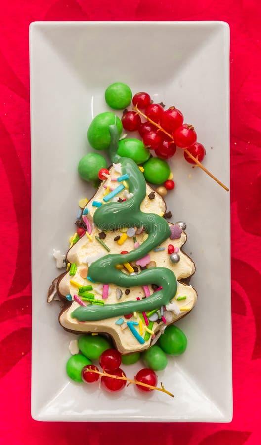 Ice Cream Shaped Like A Christmas Tree And Decorated With Candy And