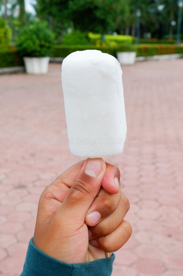 Ice cream sticks hand stock photo. Image of shell, hand - 97320552