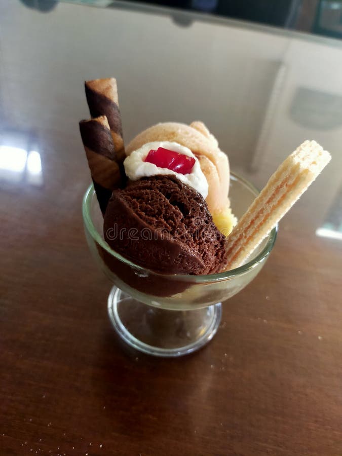 Ice cream at table stock photo. Image of cake, produce - 236442304
