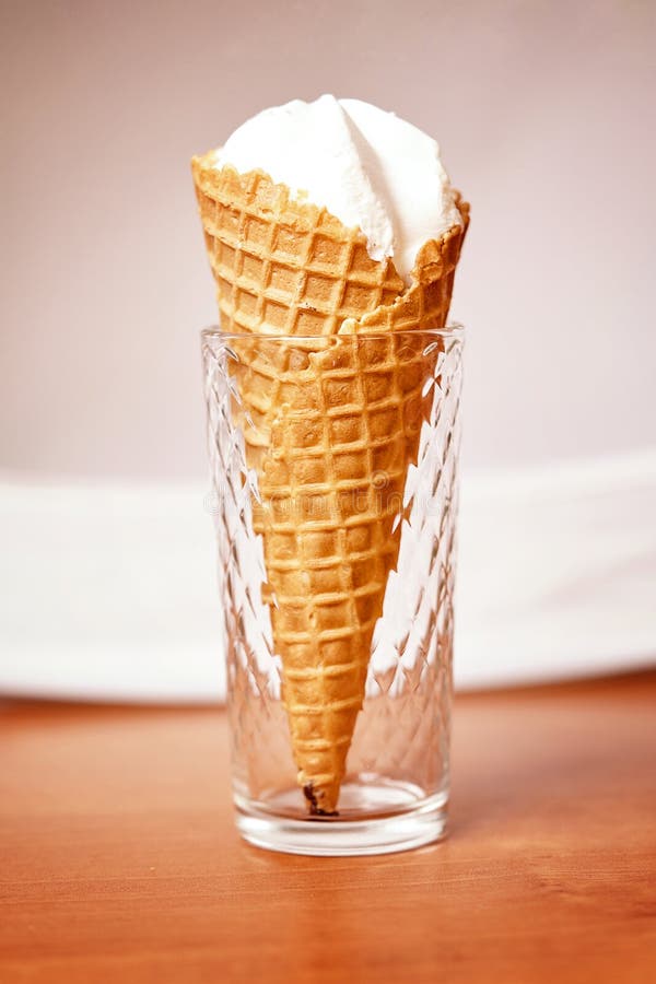 Ice Cream in a Waffle Cone is Filled in a Transparent Glass Beaker ...