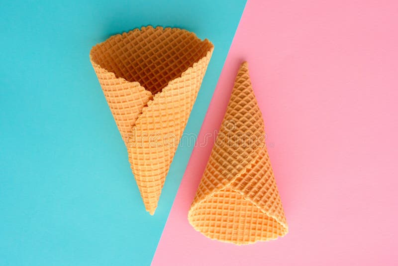 Ice Cream Waffle Cones On Pastel Pink And Blue Background Stock Image