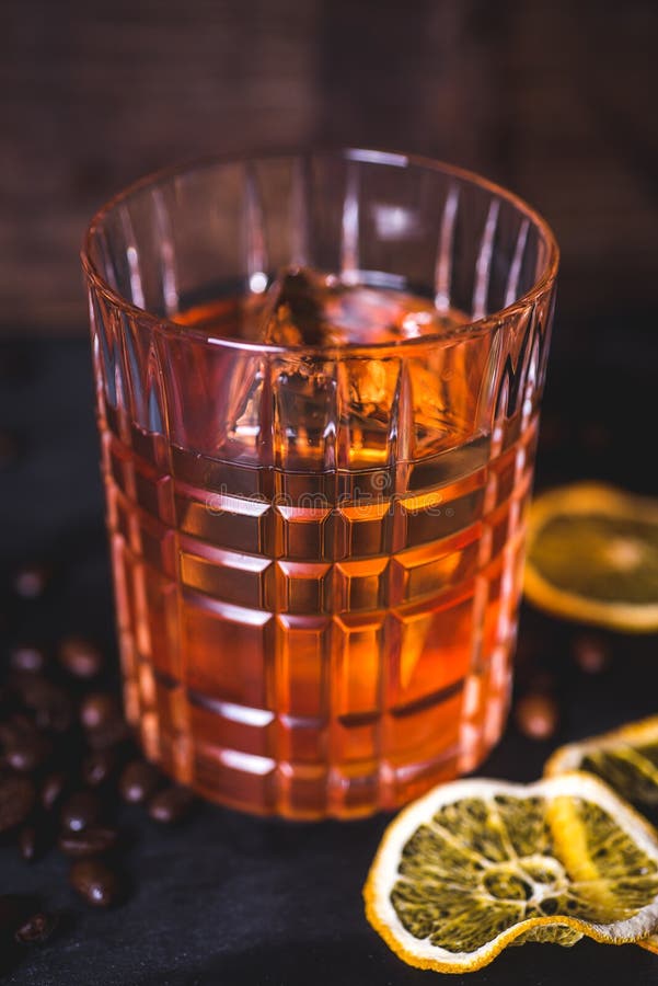 An Ice Cube Floats in Alcohol in a Glass. Stock Photo - Image of cube ... An Ice Cube Floats in Alcohol in a Glass. Stock Photo - Image of cube ...