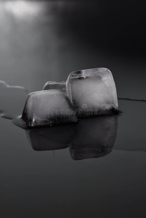 Ice Cube Melt on Grey Background Stock Image - Image of dark ...