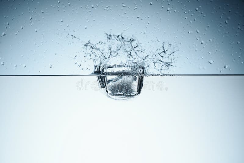 Ice Cube in Water with Splash Stock Photo - Image of background ...