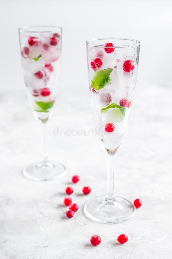 Ice Cubes with Berries and Mint in Glasses for Summer Drink White ...