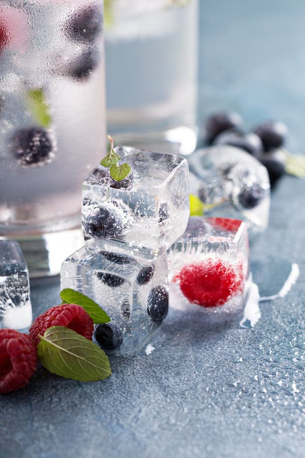 Ice Cubes with Berries and Mint Stock Photo - Image of blueberry, glass ...
