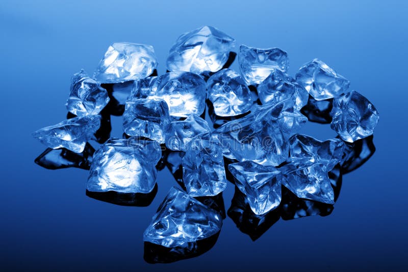 Ice cubes in blue light stock photo. Image of abstractly - 5667136