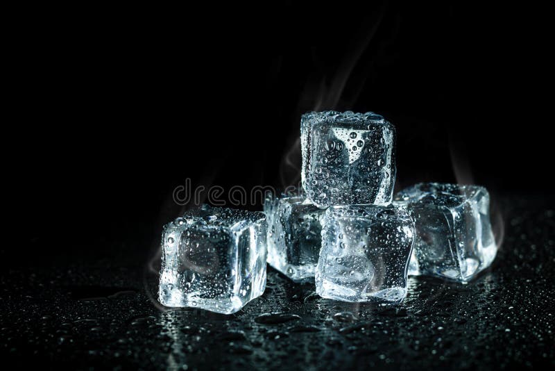 Ice Cubes and Cooling Smoke on Dark Table Background. Ice Blocks with ...