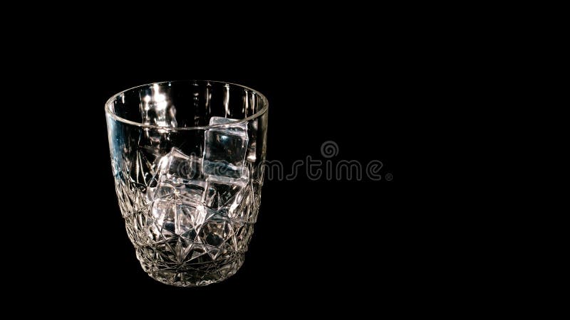 Ice Cubes Fall into a Glass Stock Photo - Image of celebration, blur ...