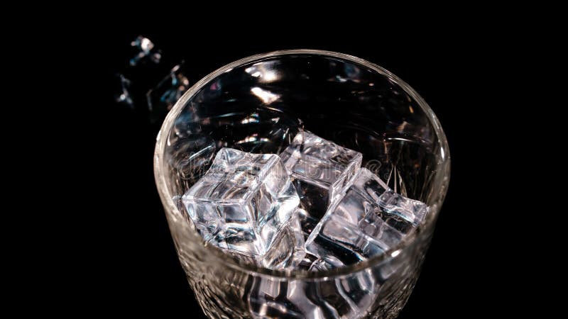 Ice Cubes Fall into a Glass Stock Photo - Image of drink, black: 143851106