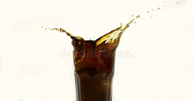Ice Cubes Falling into Glass of Coke Against White Background Stock ...