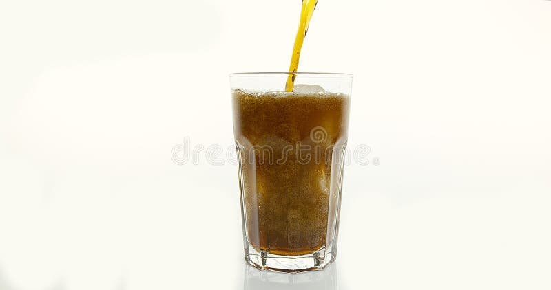 Ice Cubes Falling into Glass of Coke Against White Background Stock ...