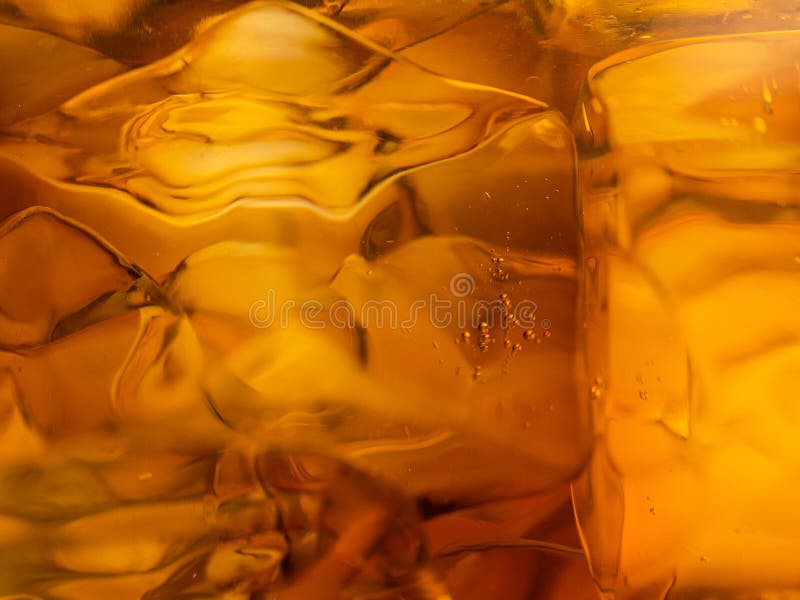 Ice Cubes in a Glass of Deep Gold Colored Whisky Stock Photo - Image of ...