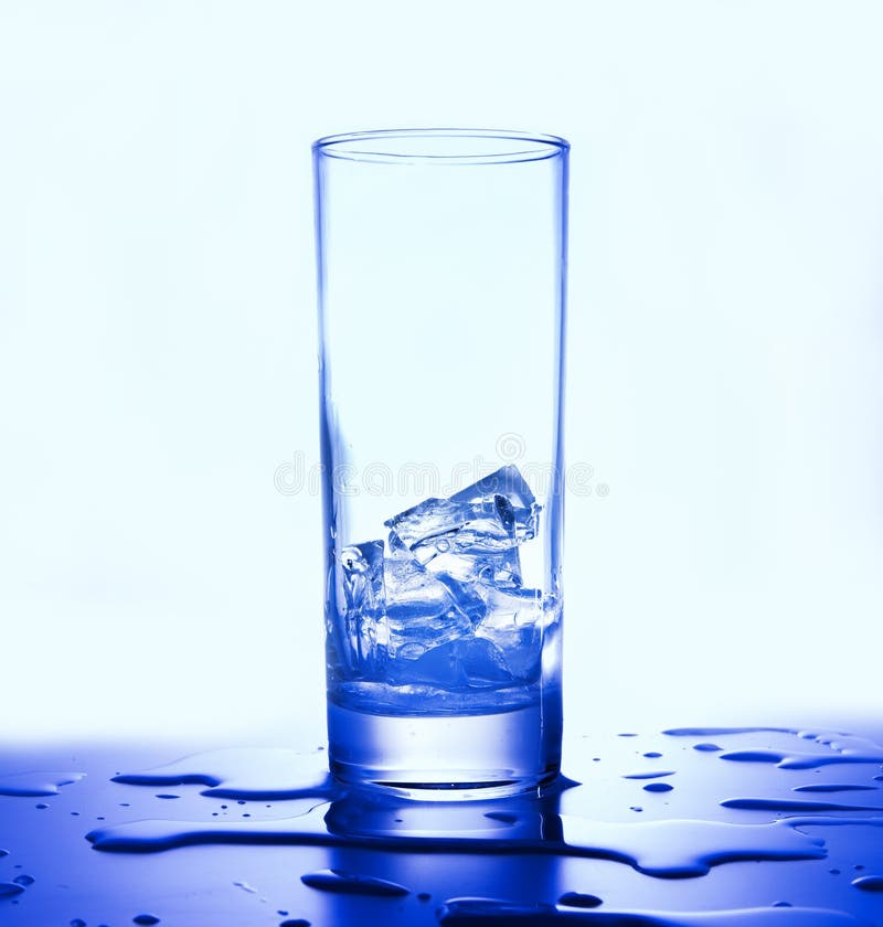 Ice Cubes in a Glass. Spreading Drops. White Blue Tone. Side View Stock ...