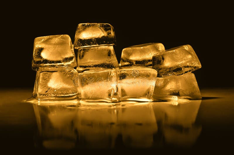 Ice cubes of gold color stock image. Image of drinks - 38094859