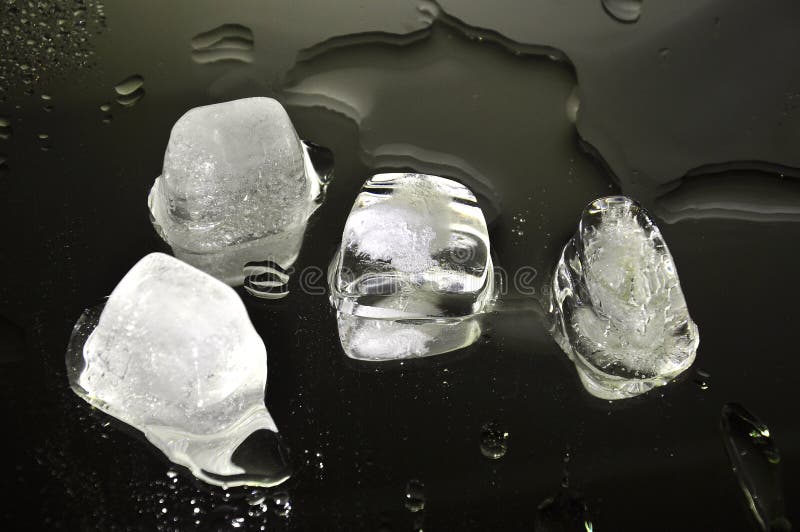 Ice Cubes on a Mirror Surface. Dark Background Stock Photo - Image of ...