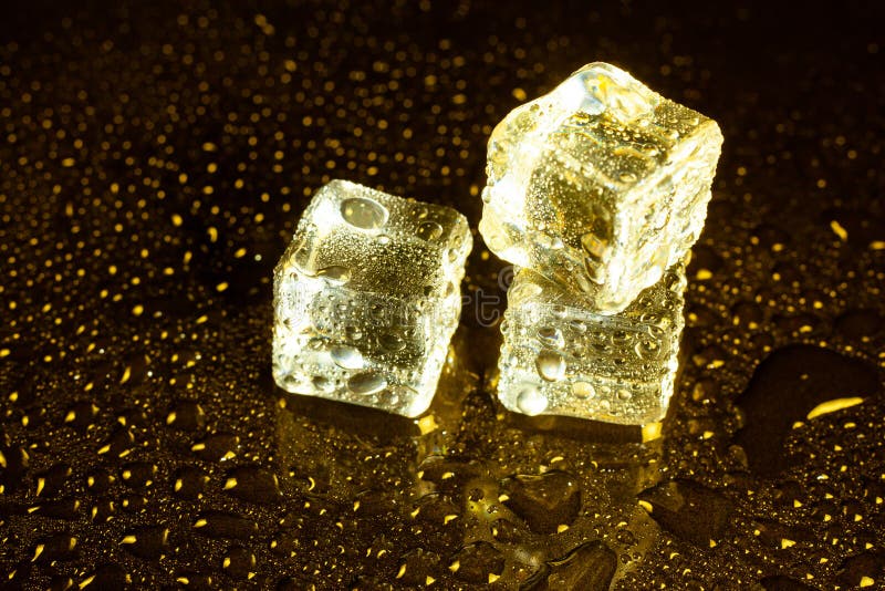 Ice Cubes on a Reflections Yellow Light Stock Image - Image of food ...