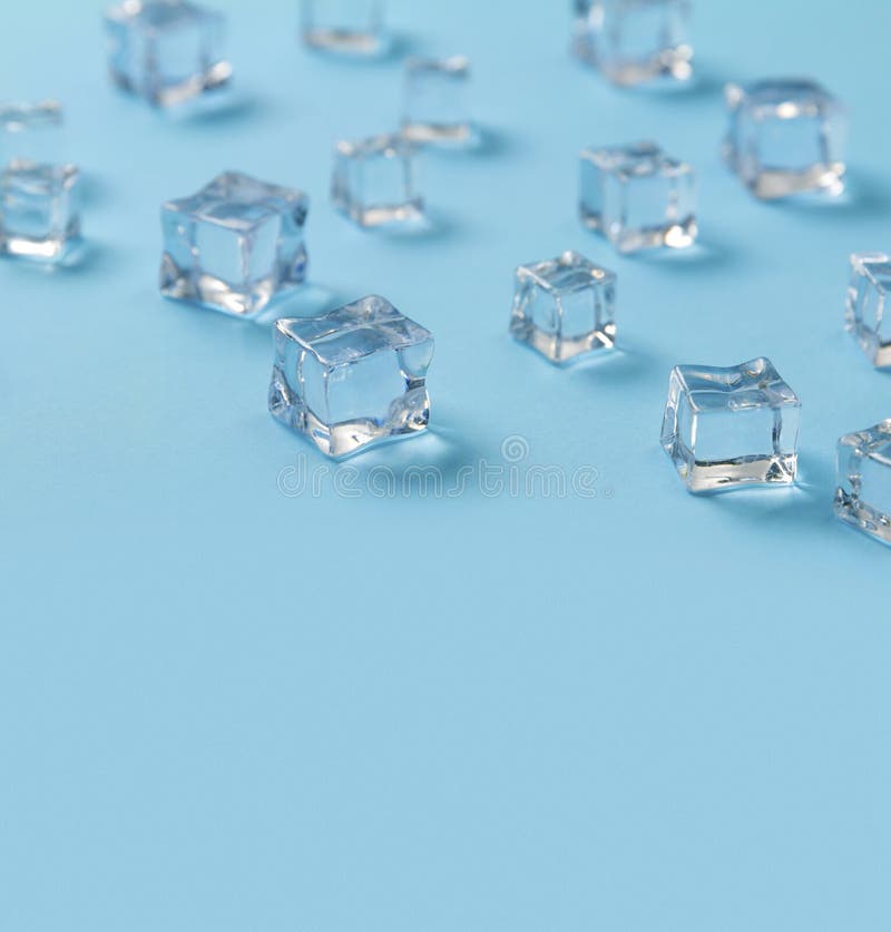 Ice Cubes Scattered on a Light Blue Background. Stock Image - Image of ...