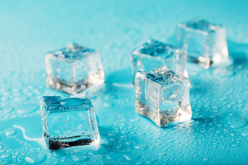 Ice Cubes are Scattered with Water Drops Scattered on a Blue Background ...