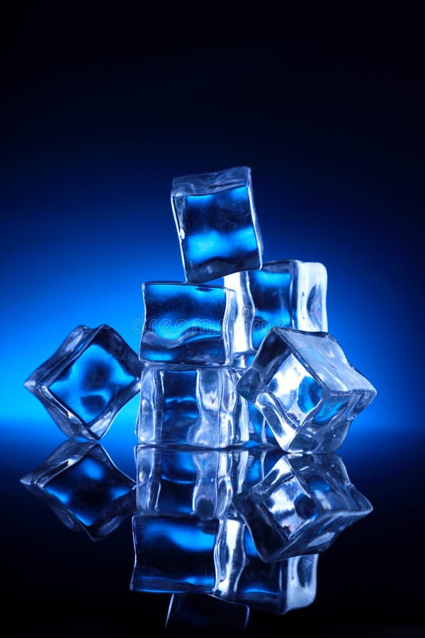 Ice Cubes Stacked Up on Blue Background Stock Image - Image of black ...