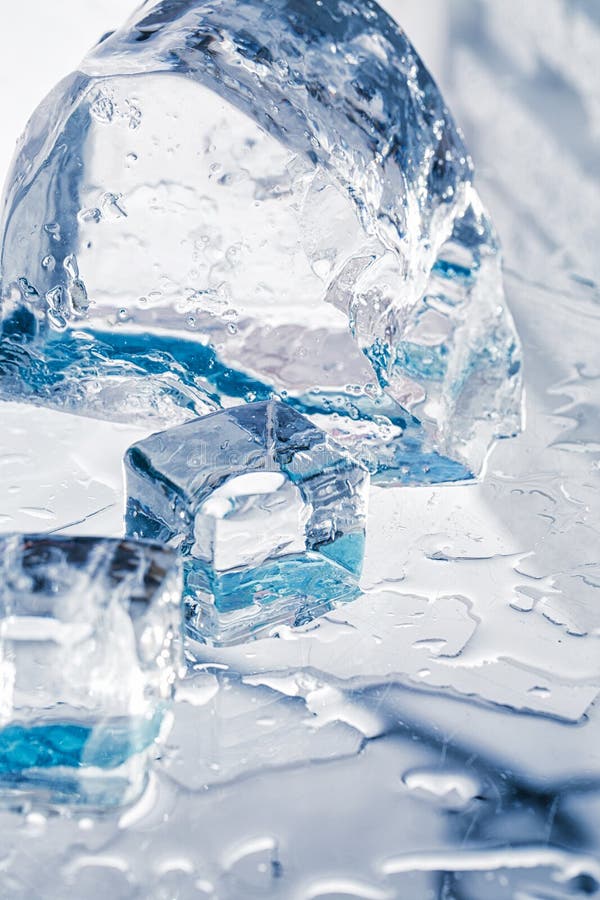 Ice cubes on the table stock image. Image of light, chunk - 74300299