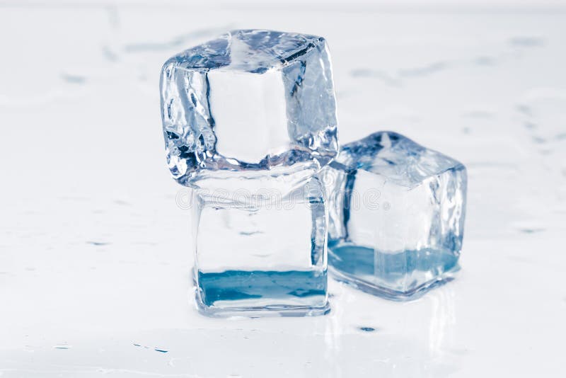 Ice cubes on table stock photo. Image of transparent - 75246914