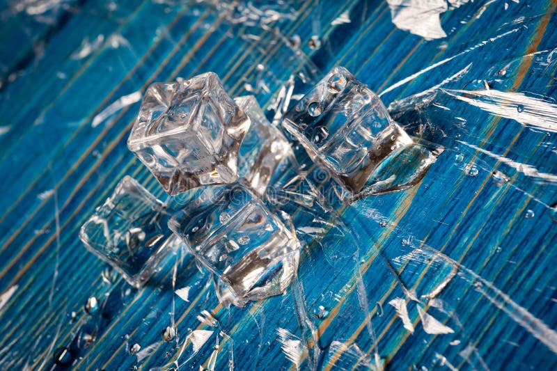 Ice Cubes with Water Drops on a Blue Wooden Surface Stock Illustration ...