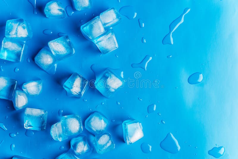 Ice Cubes and Water Drops Scattered on Blue Background Stock Image ...