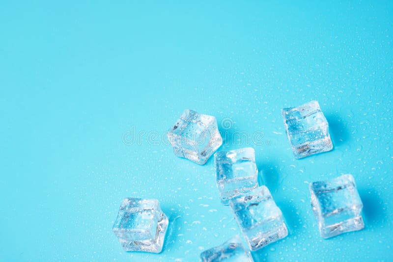 Ice Cubes with Water Drops Scattered on a Blue Background, Top View ...