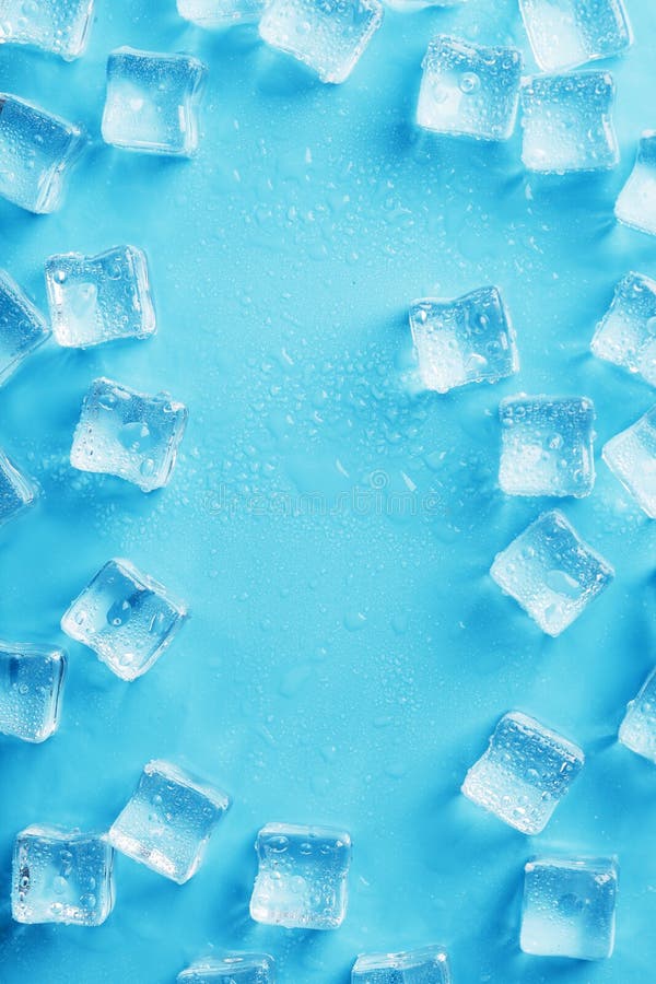 Ice Cubes with Water Drops Scattered on a Blue Background, Top View ...
