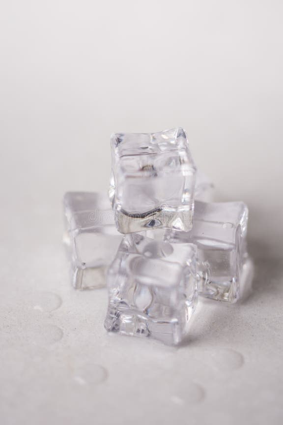 Ice Cubes with Water Drops on the White Marble Background Stock Image ...