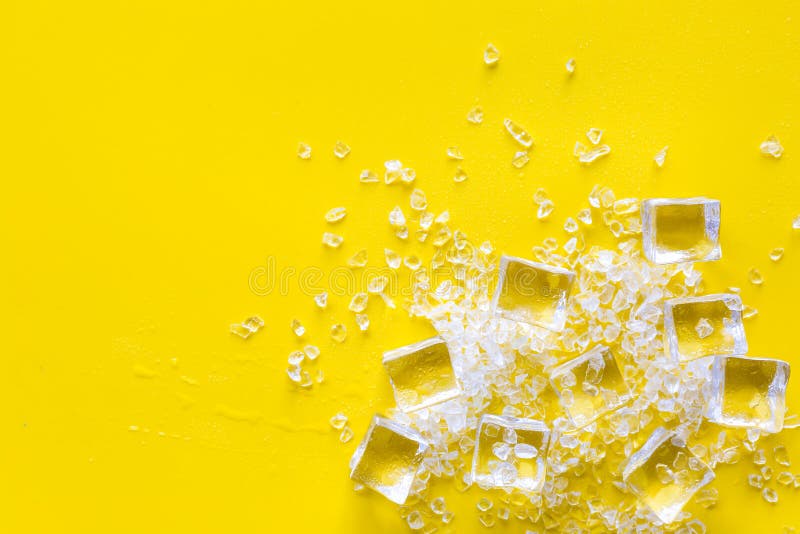 Ice Cubes on Yellow Table Top View Mock Up Stock Photo - Image of ...