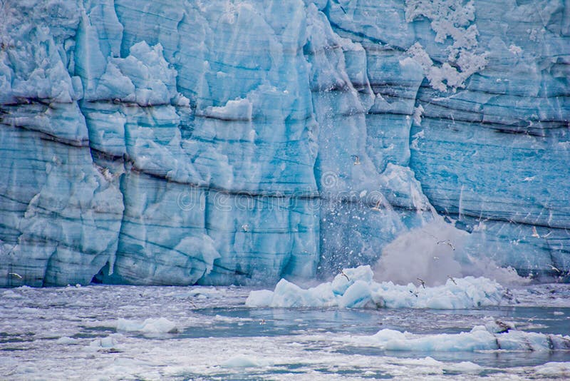 Ice Falling from the Glacier and Birds Flying Over it. Stock Photo ...