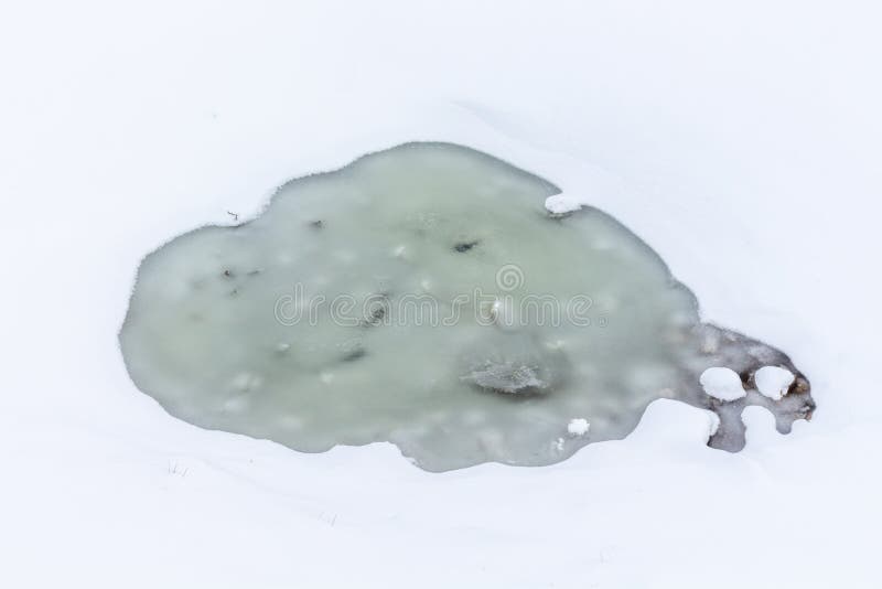 Ice-filled Hole in Snow Covered Ground, Derbyshire, UK Stock Image ...
