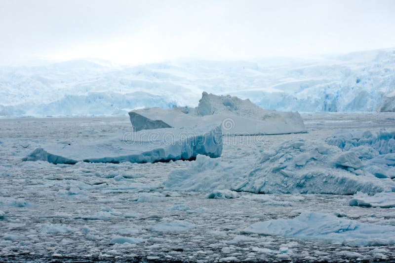 Ice Flow and Cracked Ice with Shelf Ice of Glacier in Background ...