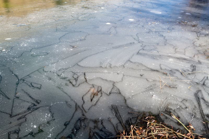Ice Forms Patterns in a Frozen Pond Stock Image - Image of lake ...