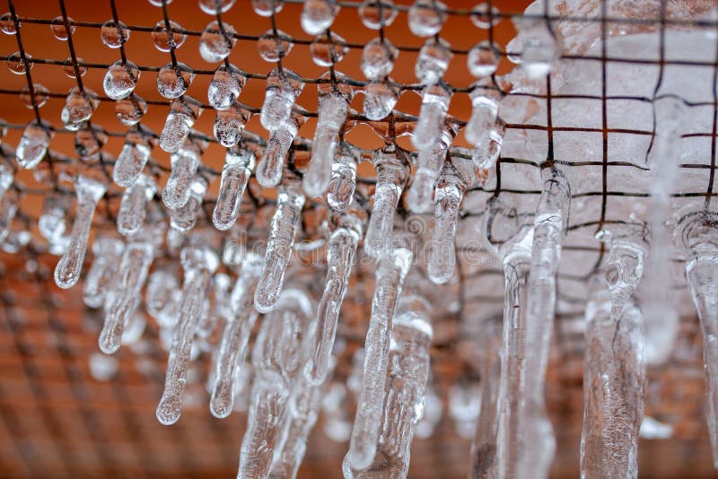 Ice on the Grate Formed after an Icy Rain with Icicles after Freezing ...
