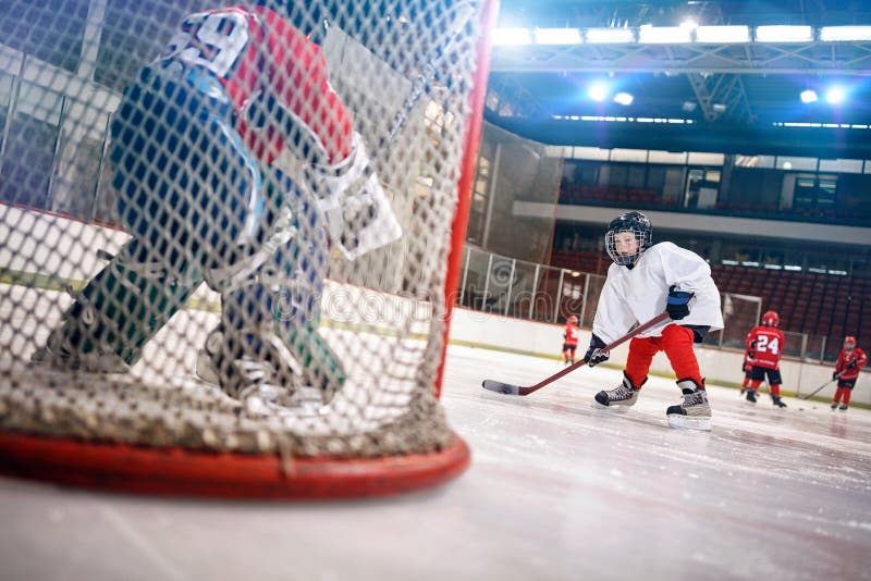 Ice Hockey Player Shoots the Puck on Goal Stock Photo - Image of minor ...