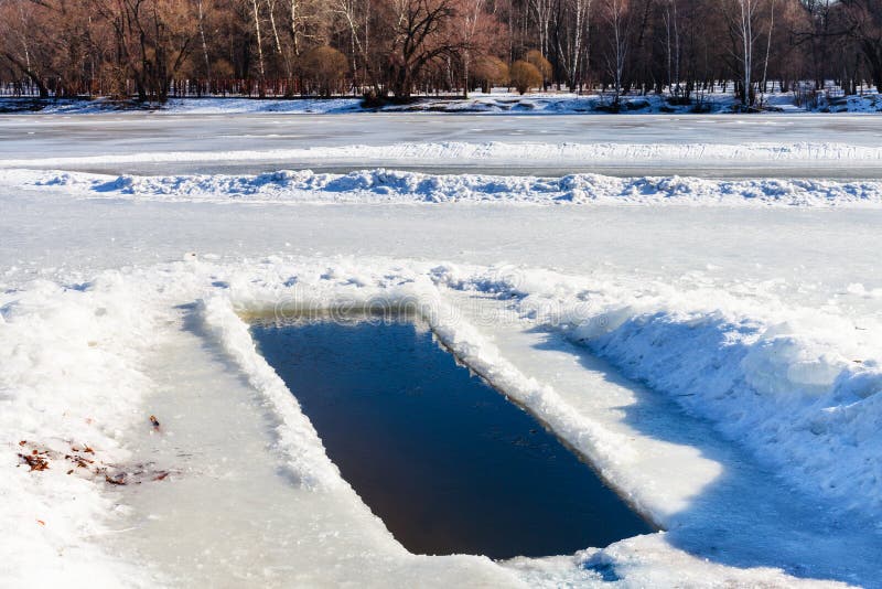 Ice-hole in frozen lake stock photo. Image of surface - 67378864