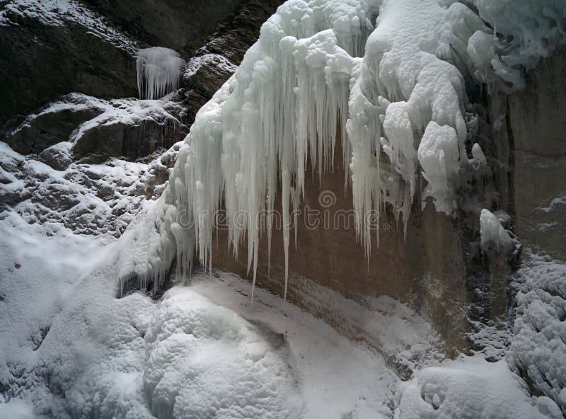 Ice Icicles on the Rocky Mountain with a Snow Stock Photo - Image of ...