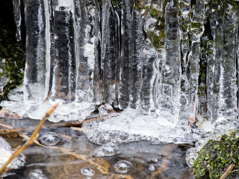 Ice, icicles in water stock photo. Image of abstract - 141961622