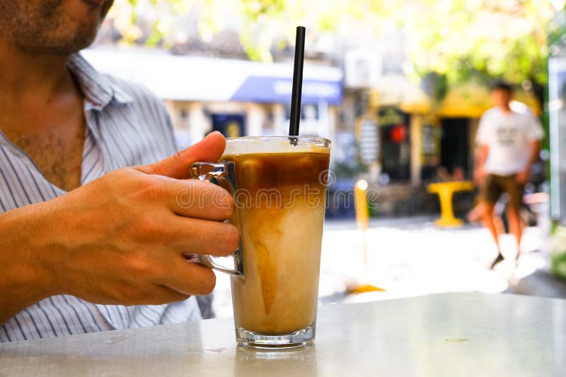 Ice Latte Coffee with a Straw on the Table. Stock Image - Image of cold ...